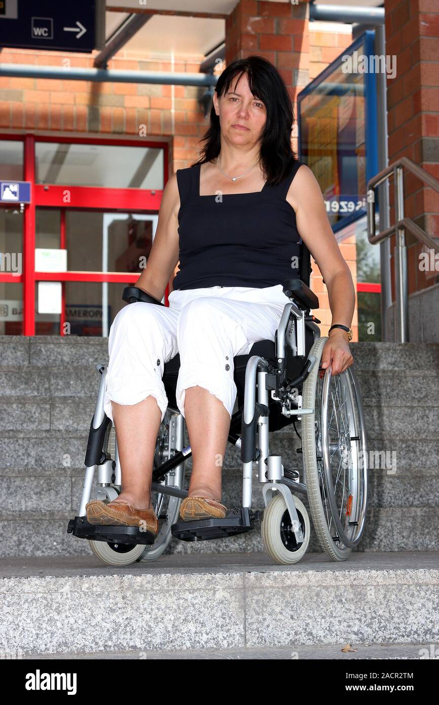 Disabled woman in a wheelchair, everyday life in the city Stock Photo ...