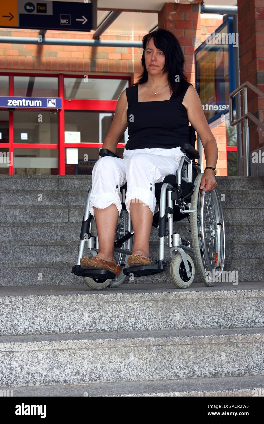Disabled woman in a wheelchair, everyday life in the city Stock Photo ...