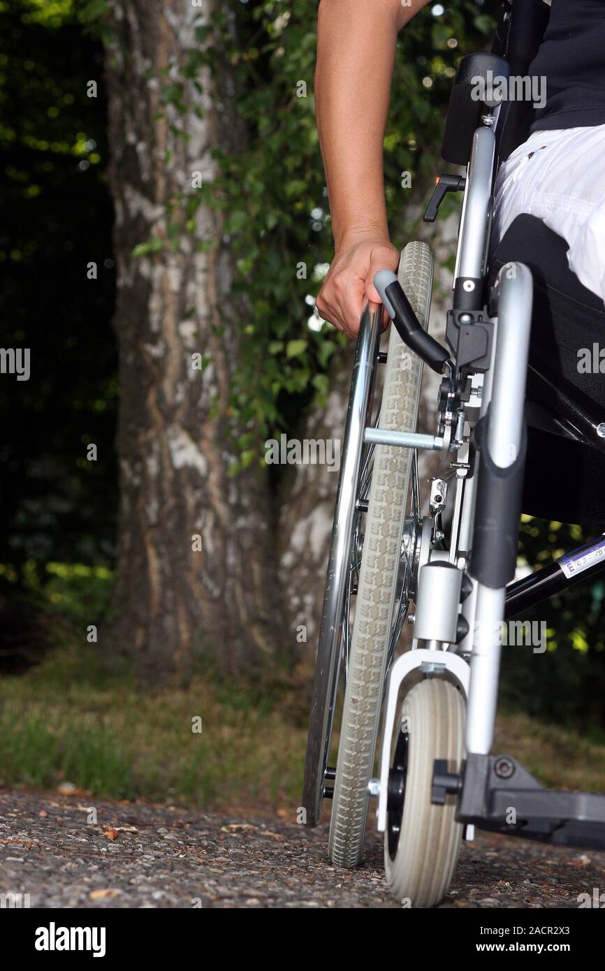 Disabled woman in a wheelchair, everyday life in the city Stock Photo ...