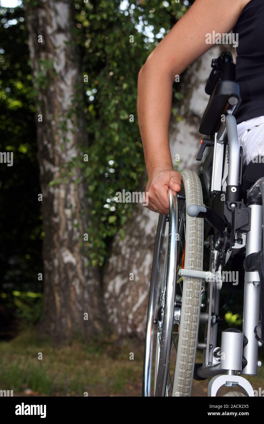 Disabled woman in a wheelchair, everyday life in the city Stock Photo ...