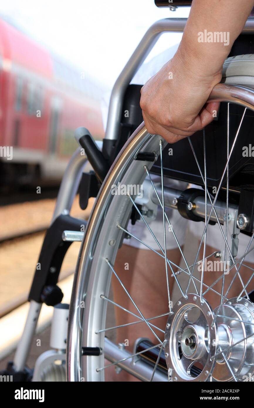 Disabled woman in a wheelchair, everyday life in the city Stock Photo ...
