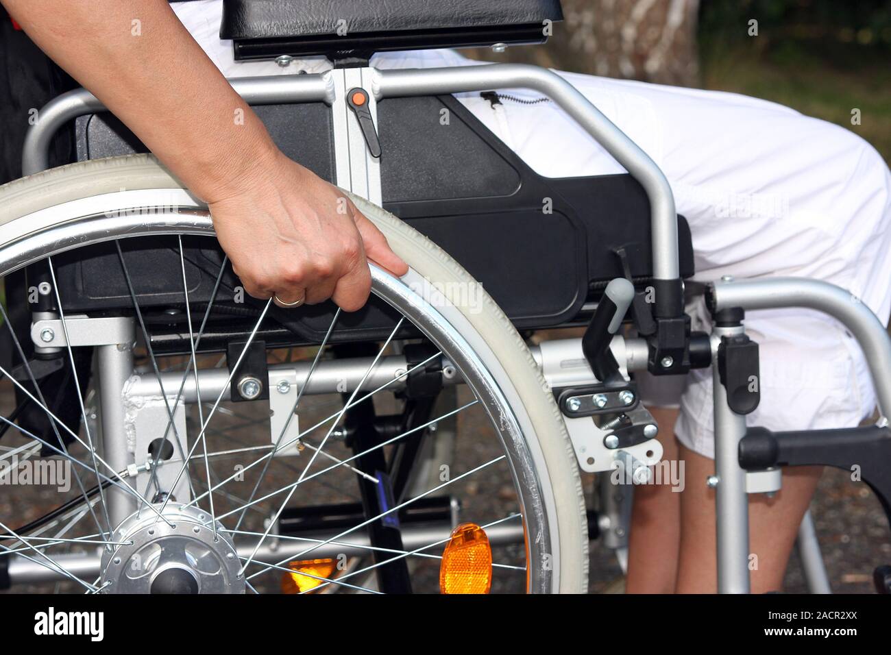 Disabled woman in a wheelchair, everyday life in the city Stock Photo ...