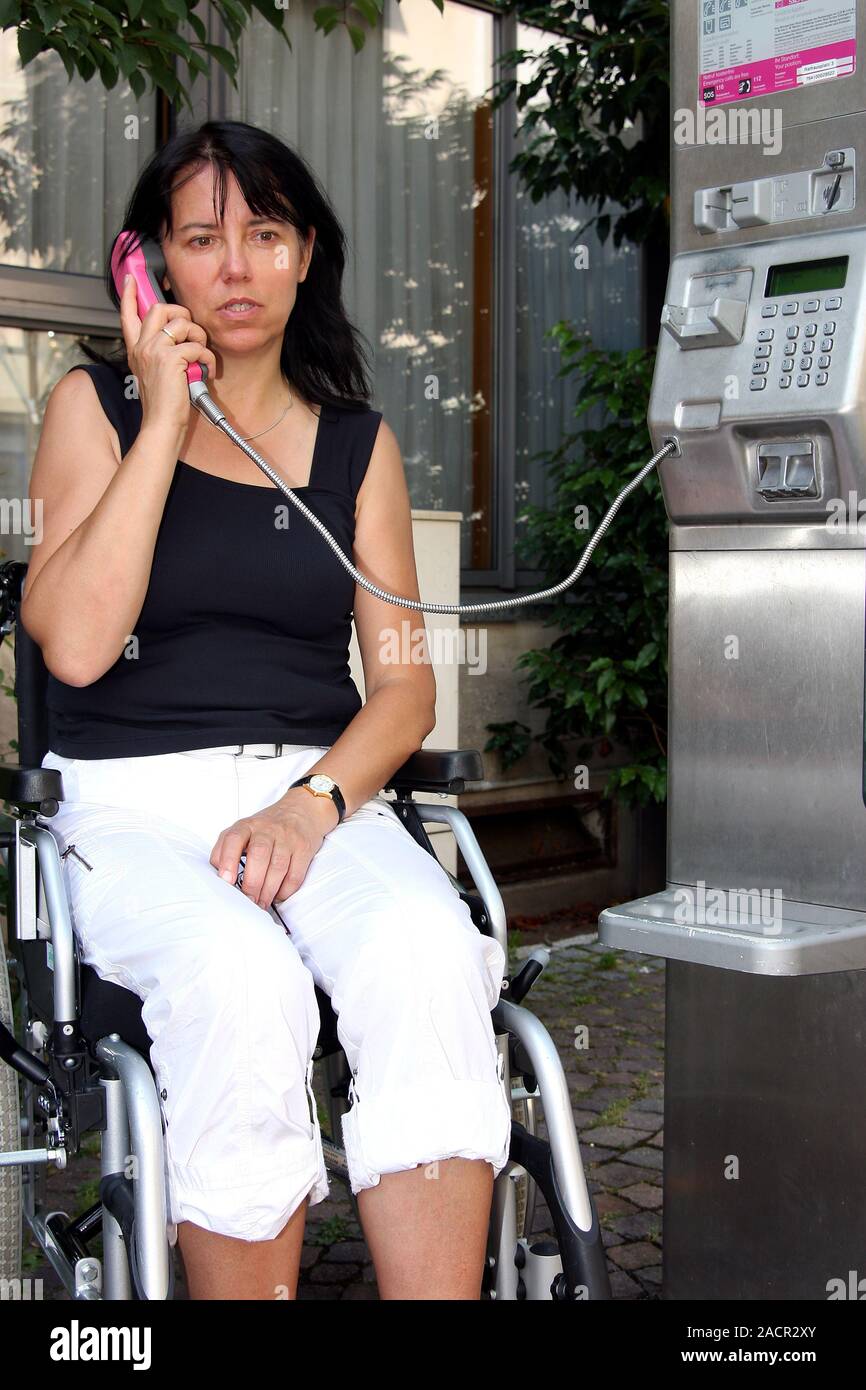 Disabled woman in a wheelchair, everyday life in the city Stock Photo ...