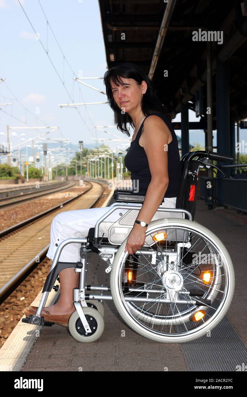 Disabled woman in a wheelchair, everyday life in the city Stock Photo ...