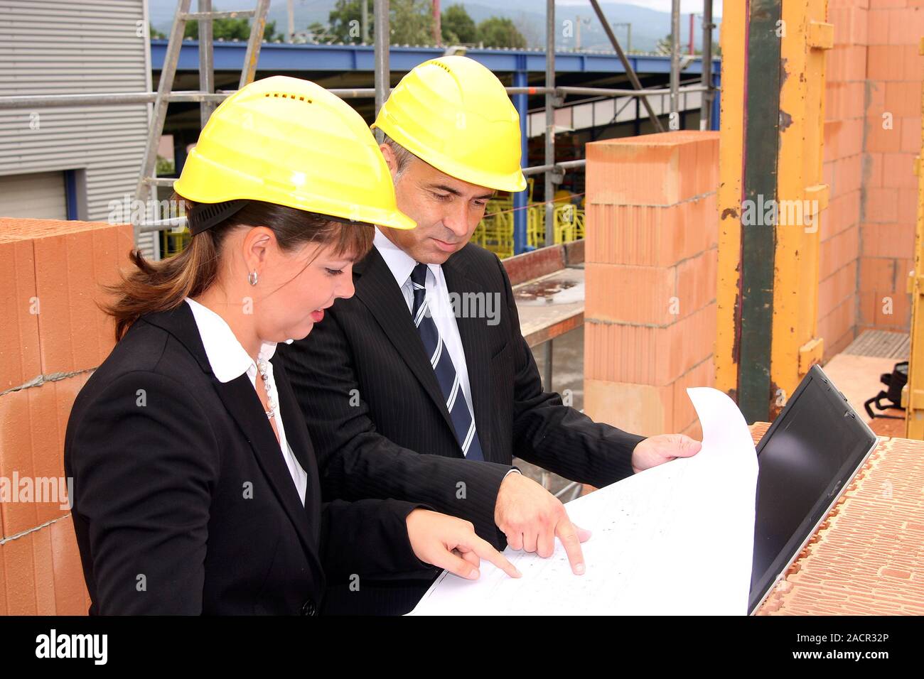 Architects on the construction site Stock Photo - Alamy