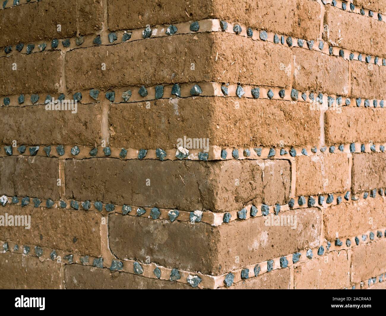 Adobe brickwork. Adobe is a building material that consists of sand ...