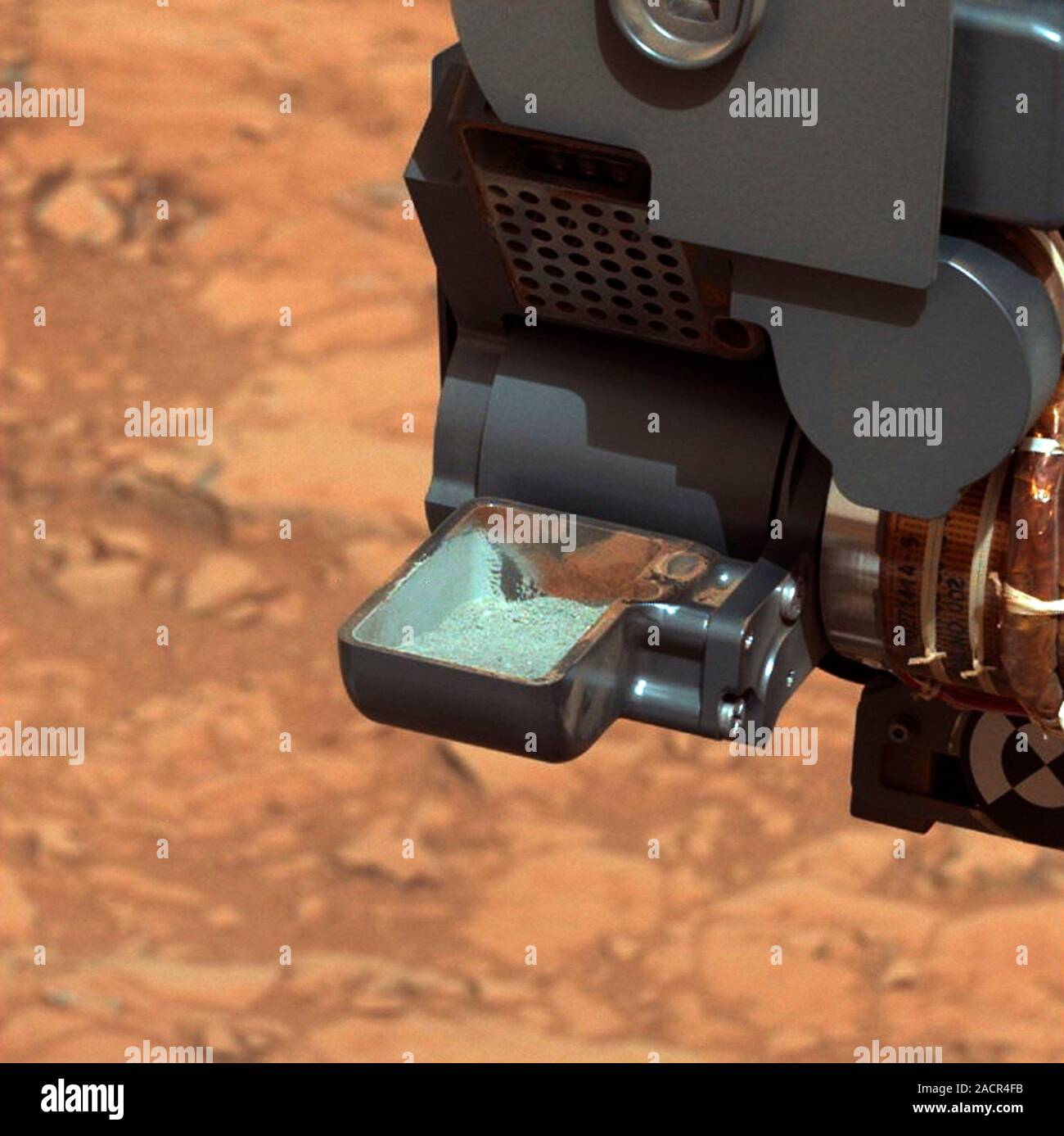 Curiosity rover drilling sample. This first sample taken by the ...