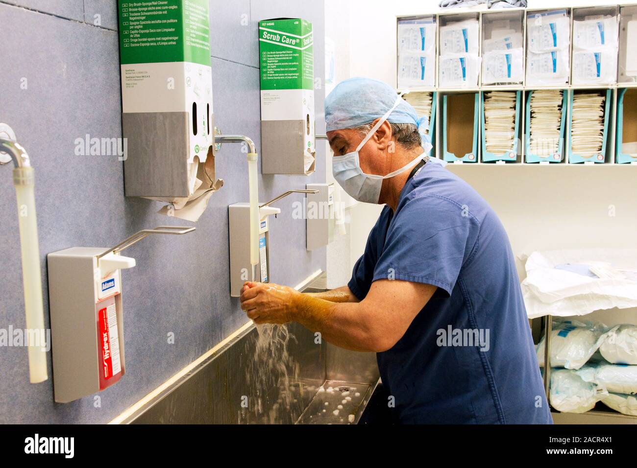 Doctor scrubbing up before surgery. Rigorous hygiene is necessary to ...