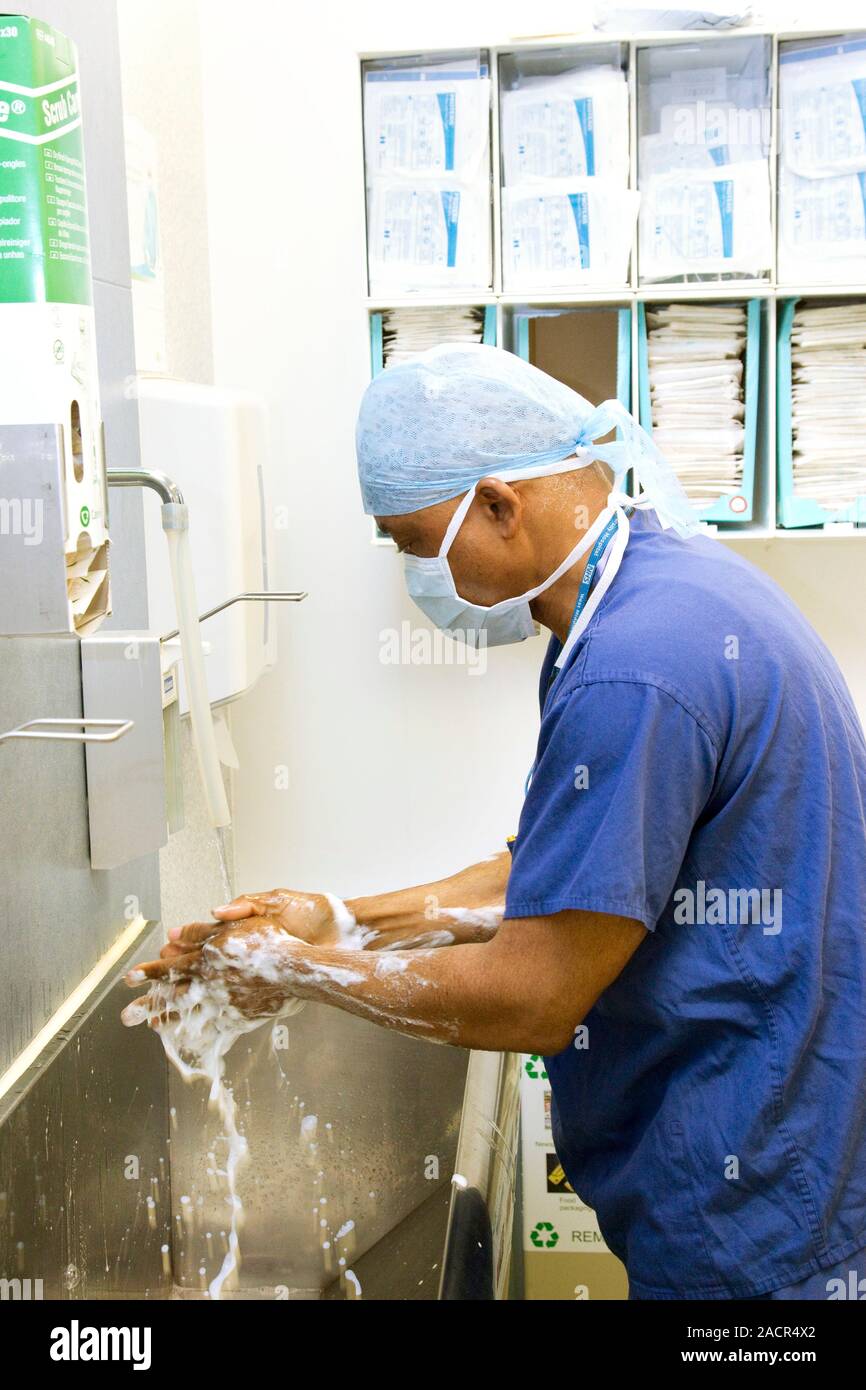 Doctor scrubbing up before surgery. Rigorous hygiene is necessary to ...