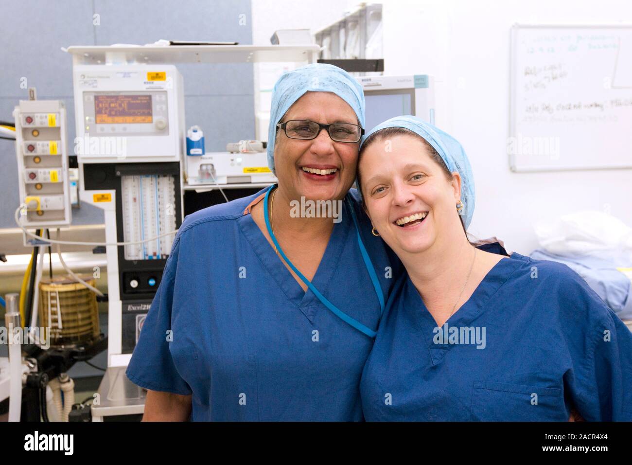 Hospital staff. Smiling nurses in an operating theatre Stock Photo - Alamy