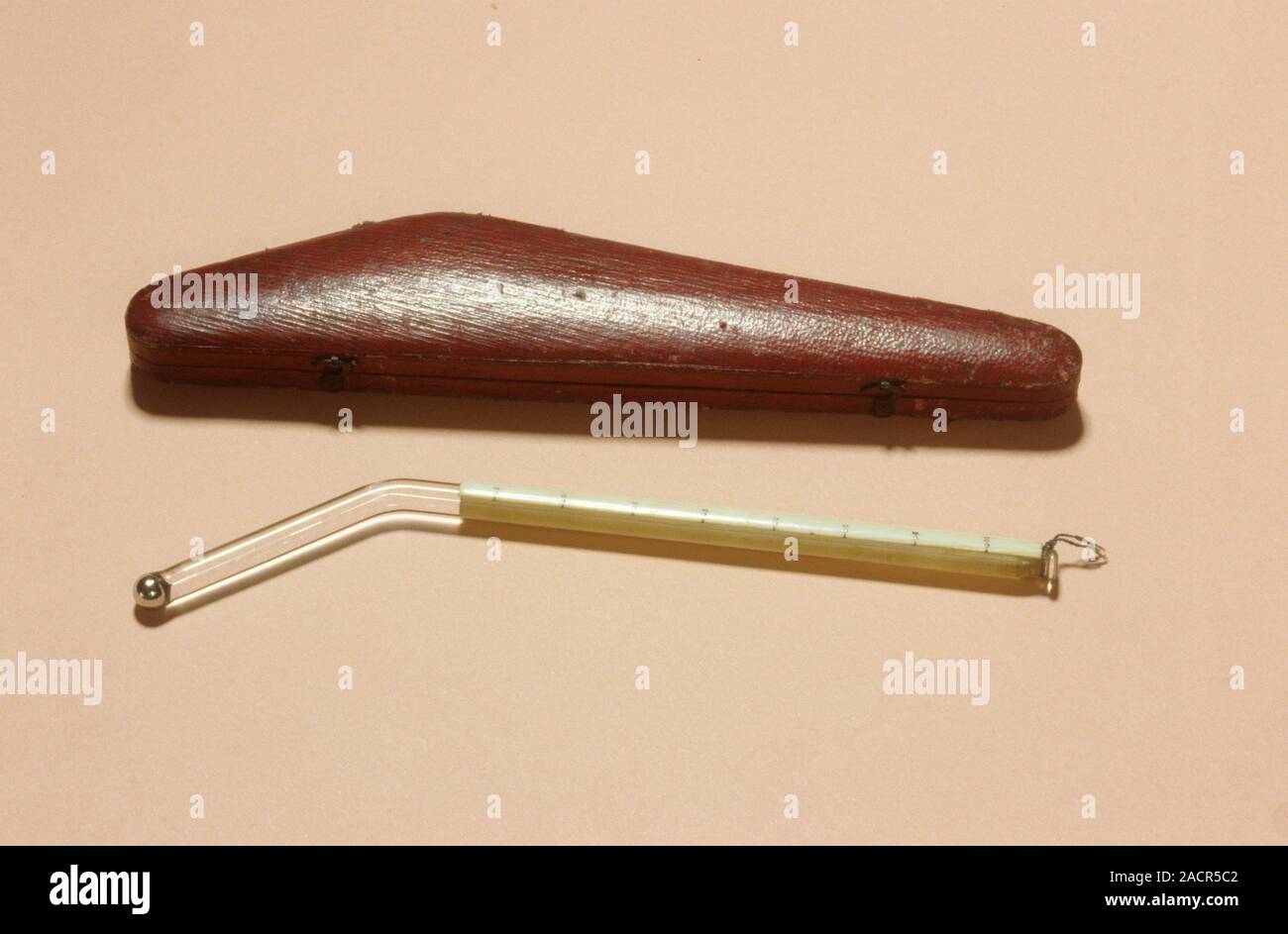 Unusual bent medical thermometer made from glass with an ivory scale ...