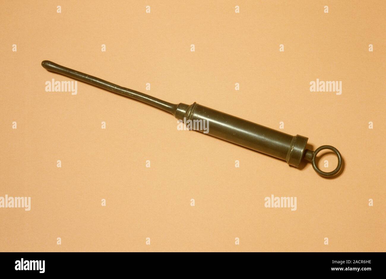 Nineteenth century pewter syringe for administering ointment. This ...