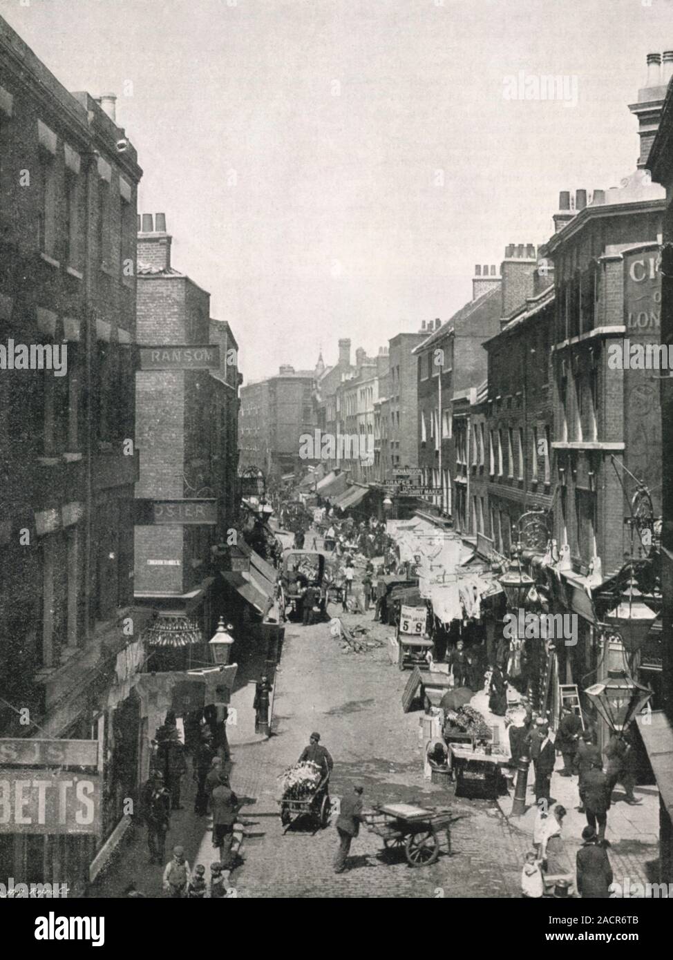 Brick Lane, London, 1890s, with shops and traders. This photograph, by ...