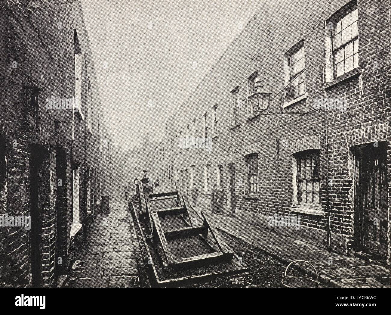 Poverty in London, 1890s. This photograph, of a street in London, was ...