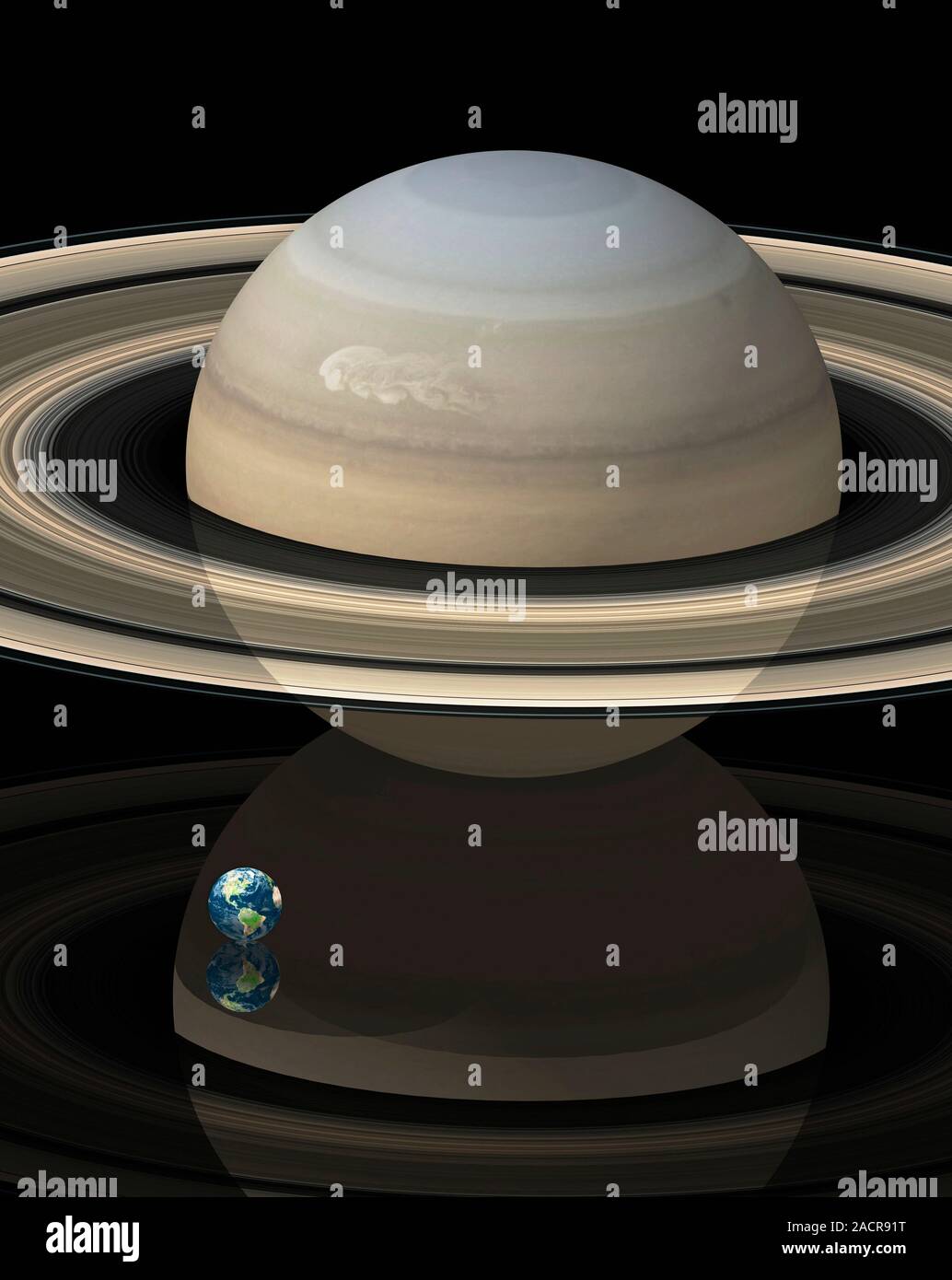 Saturn and Earth. Computer artwork comparing the size of the planet ...