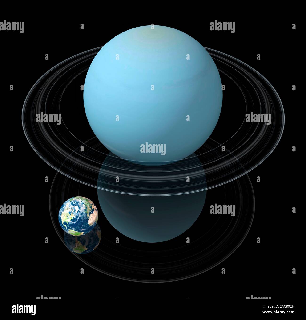 Uranus and Earth. Computer artwork comparing the size of the planet ...