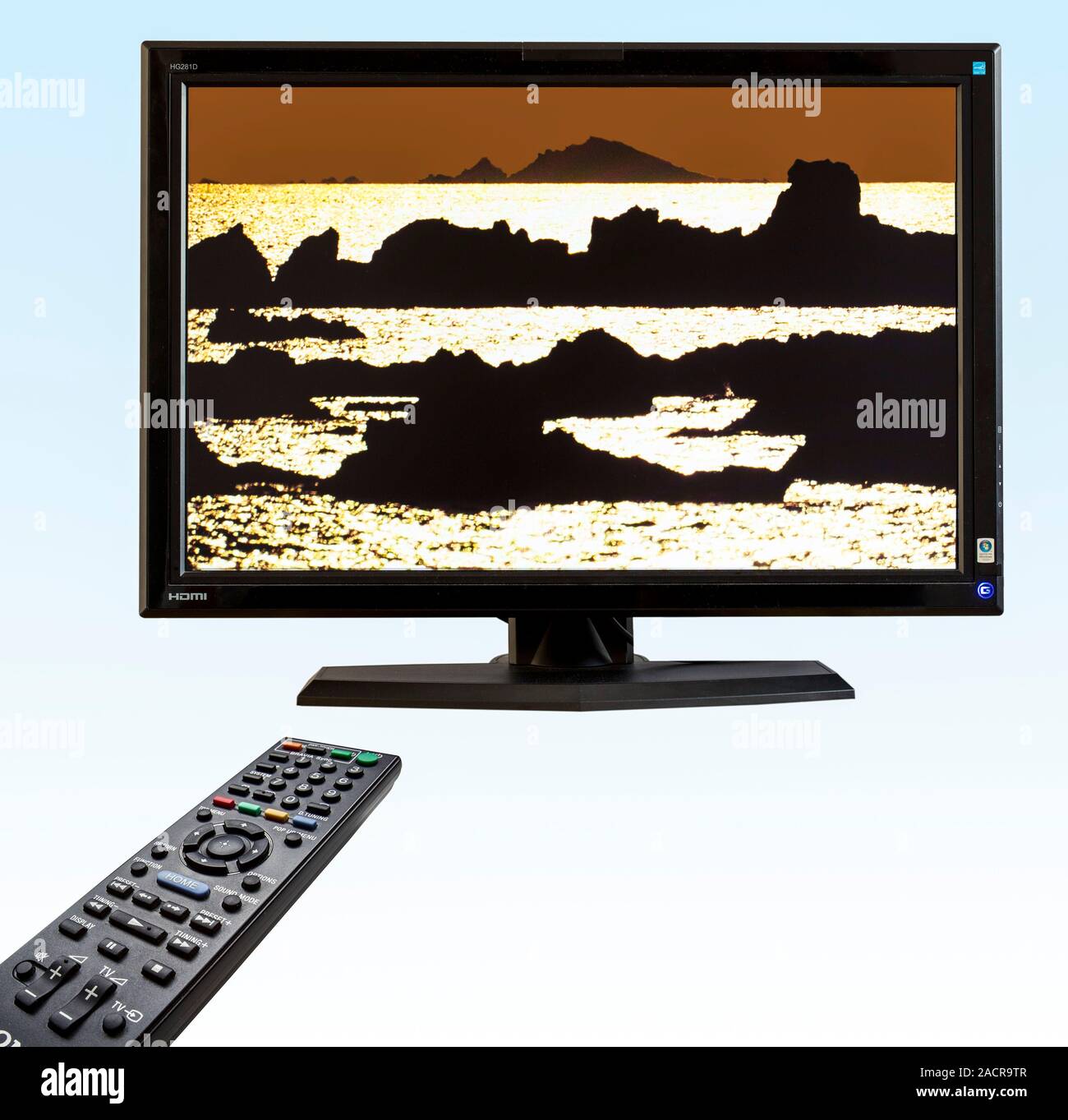 Digital television and remote control. Digital flat-screen television ...