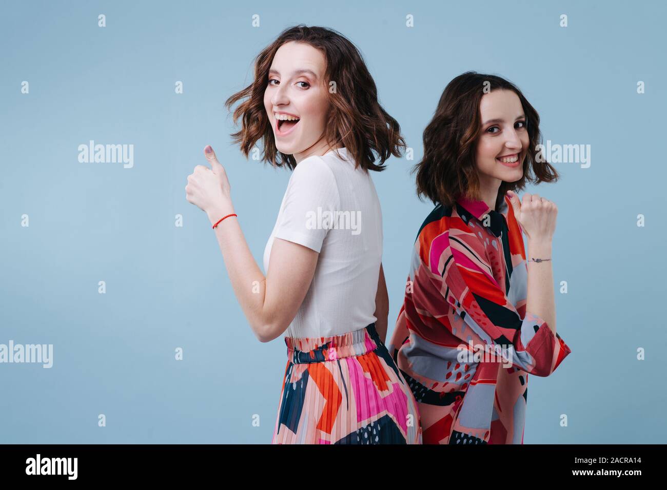 Twin sisters have fun dancing in the studio Stock Photo - Alamy
