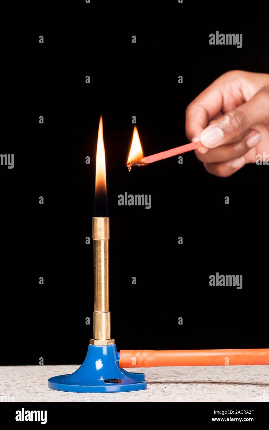 Lighting a splint with a Bunsen flame Stock Photo - Alamy