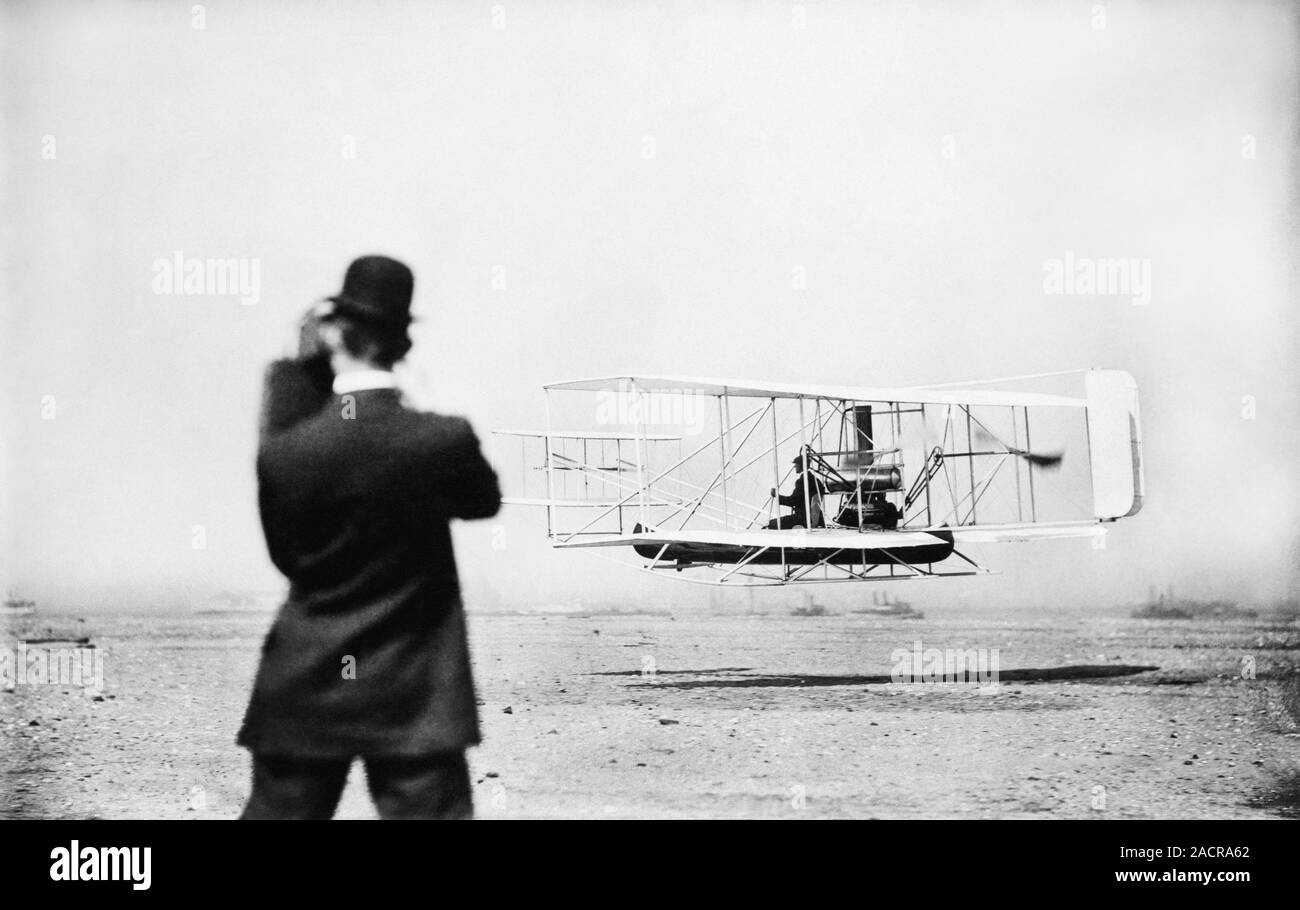 Wright Model A aircraft flight, 1909. US aviation pioneer Wilbur Wright (1867-1912) taking off ...