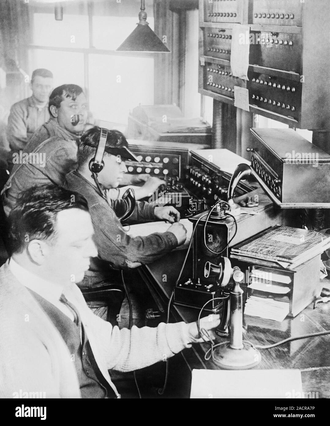 Telecommunications operators. Men operating radio and telephone ...