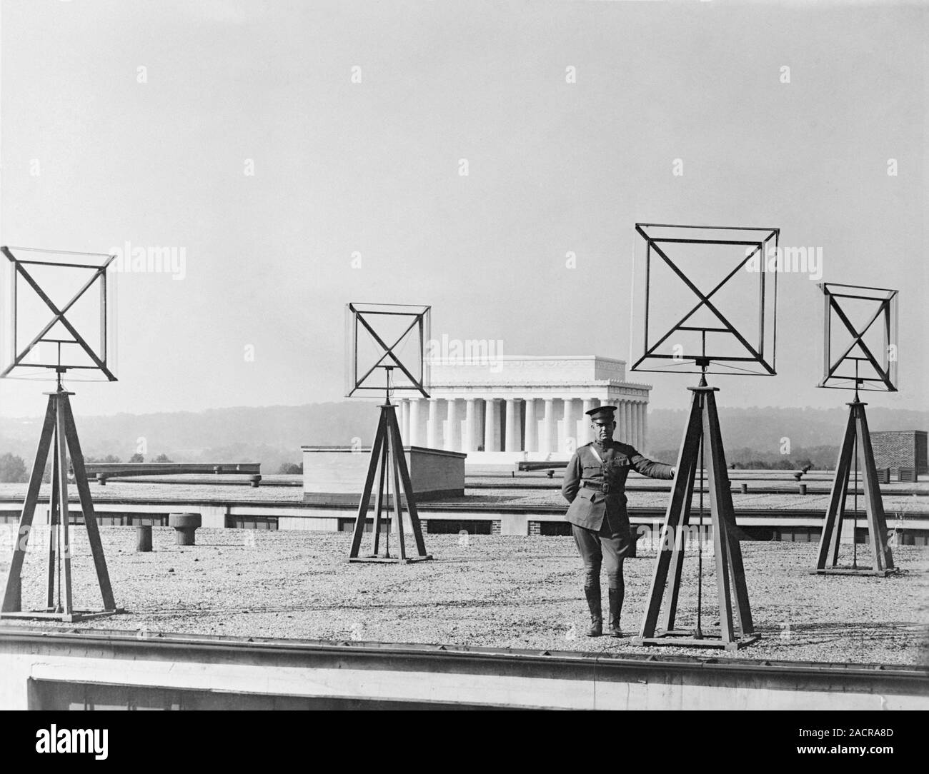Army rooftop radio antennas. US Army officer standing by 'quad' radio ...