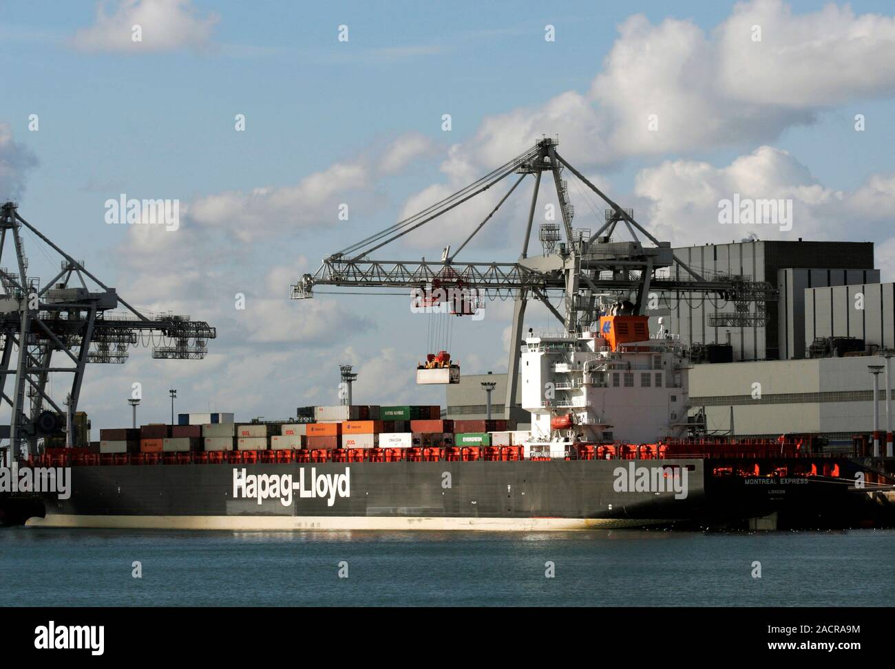 Container port. Montreal Express container ship being loaded with ...