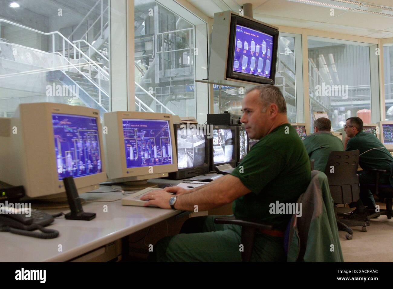 Paper mill. Workers in the control room of machine 3 at the Chapelle ...