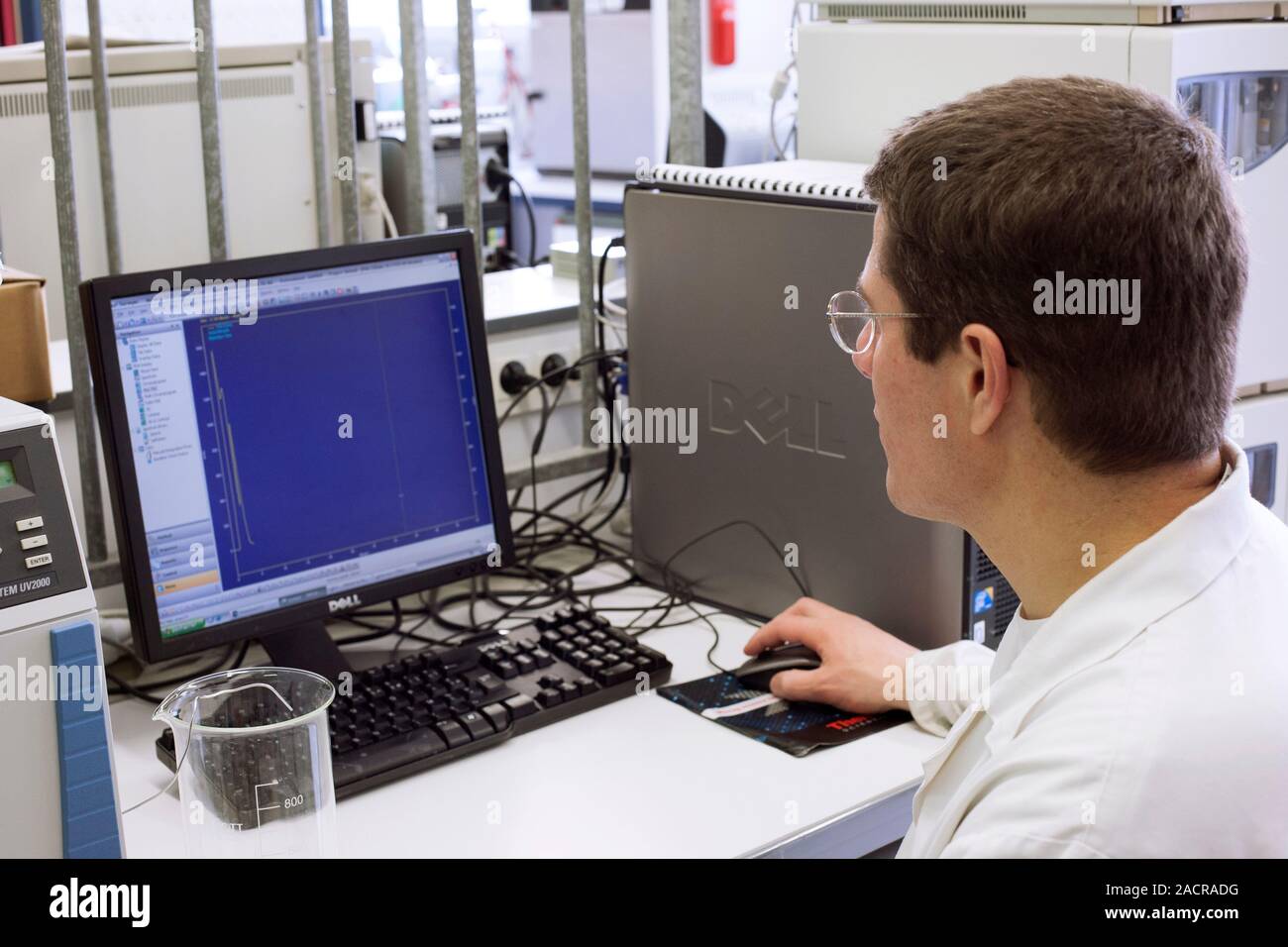 Bio-organic chemistry lab. Scientist analysing samples at the COBRA Bio ...