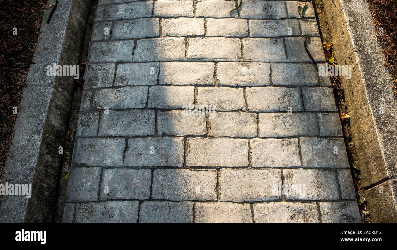 Top view on paving stone road. Old pavement of square cobblestone ...