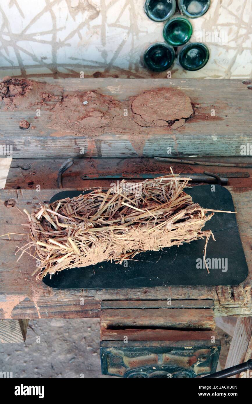 Making cob bricks. Partially made cob brick. Cob is a traditional ...