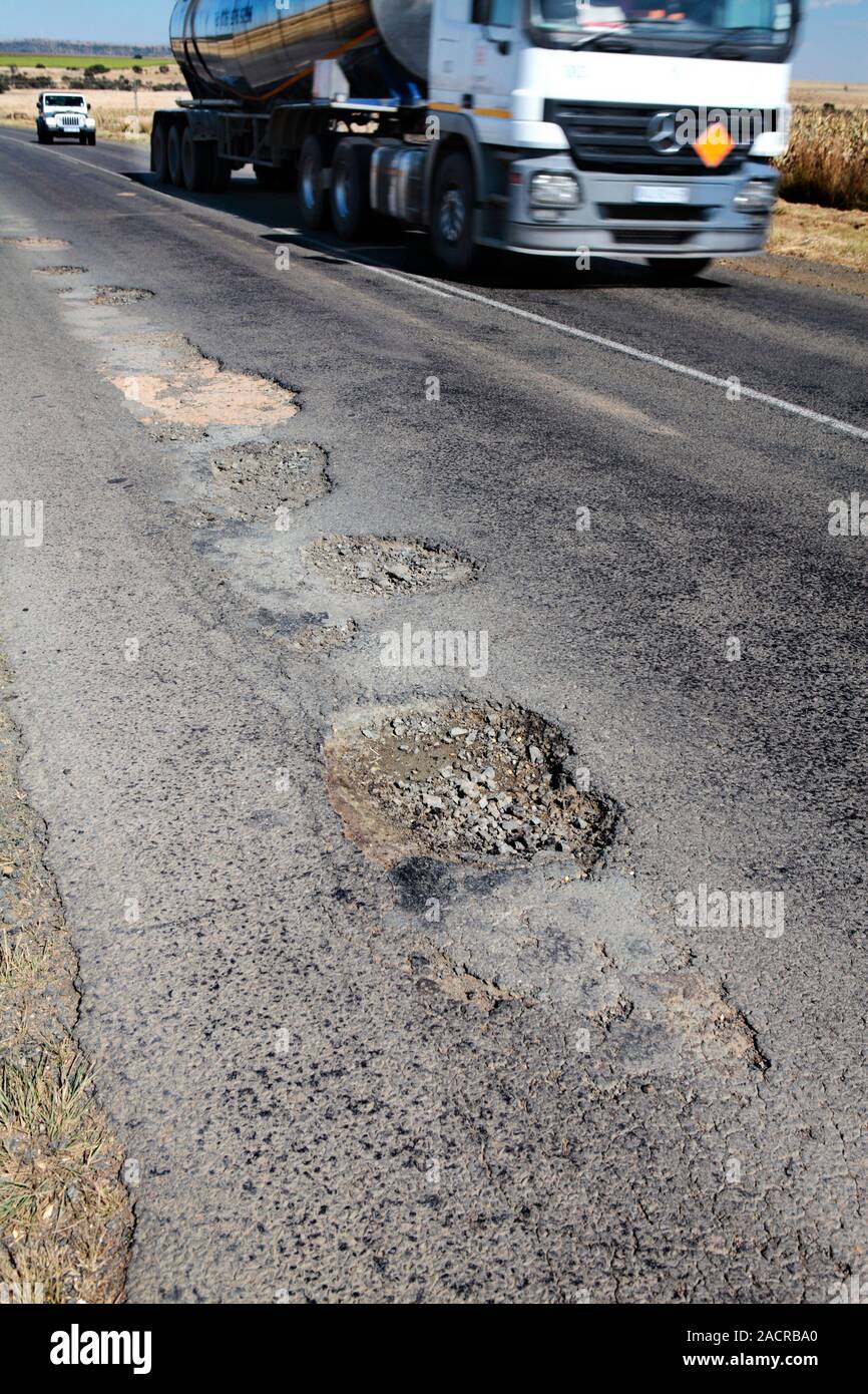 Potholes on rural road. Photographed near Hobhouse, Free State, South ...