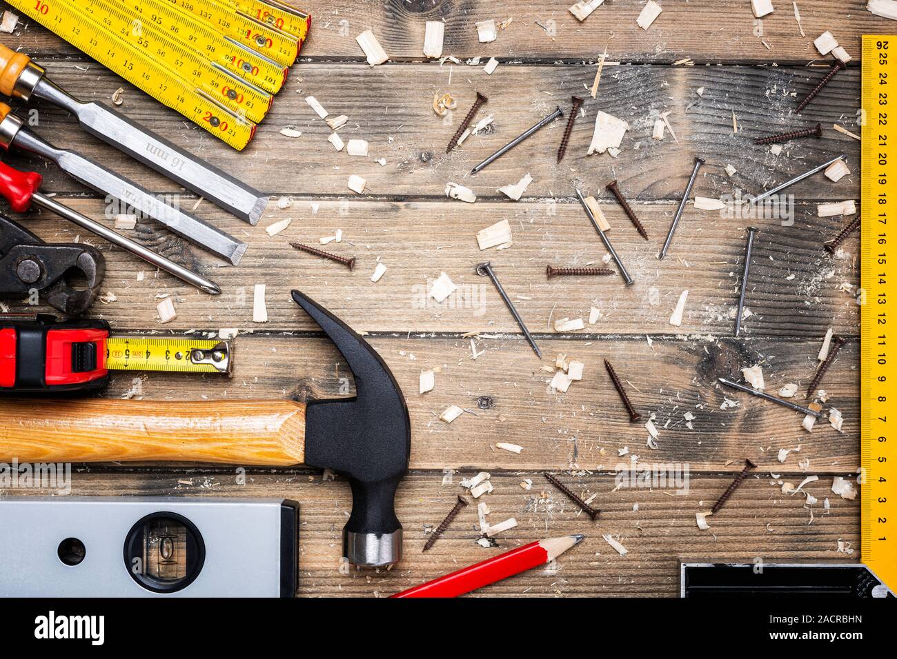 Top view of carpenter's tools on an antique wooden table. Construction ...