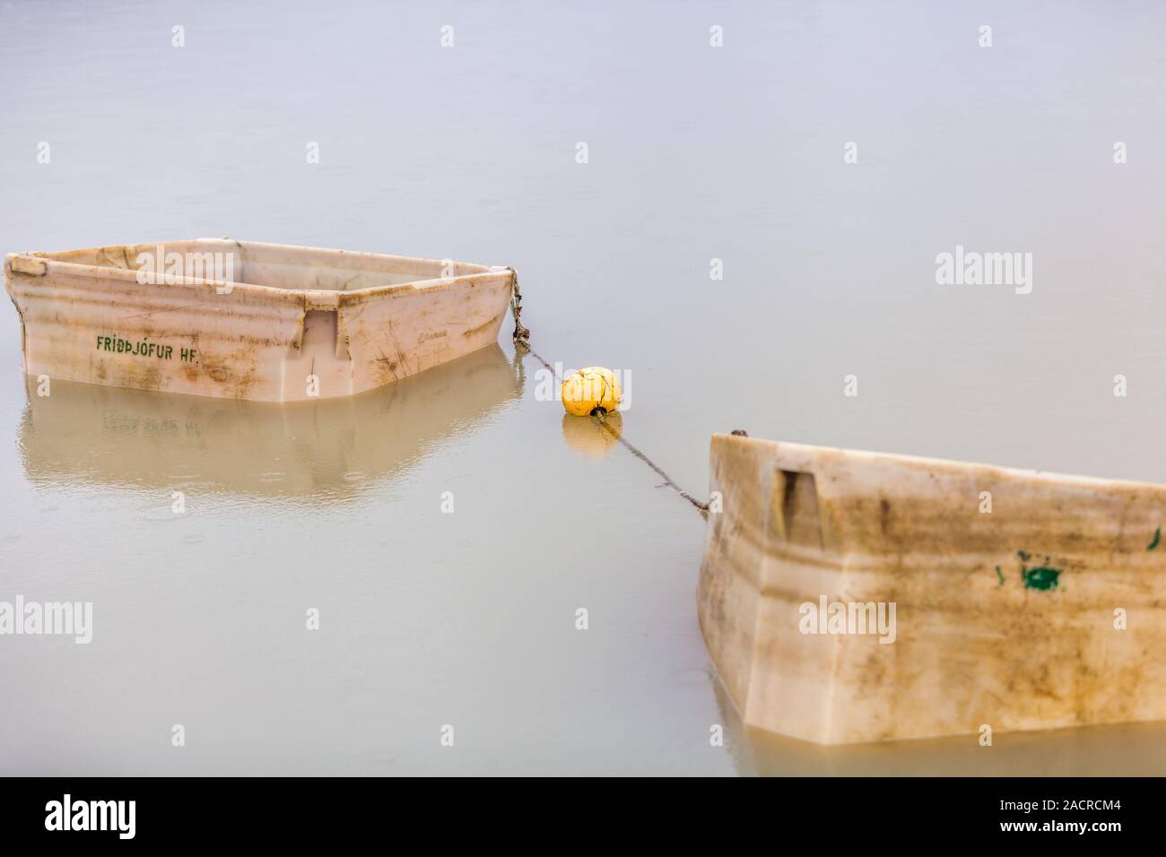 white plastic boxes floating in the water Stock Photo - Alamy