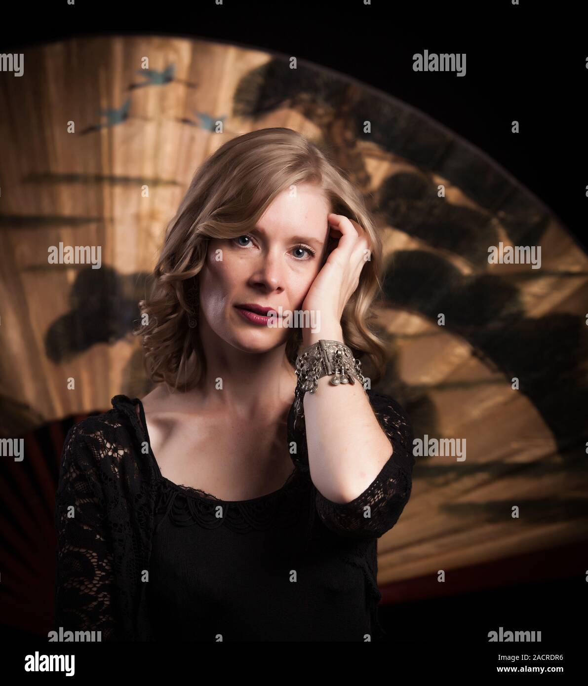 Blonde young woman lying hi-res stock photography and images - Alamy