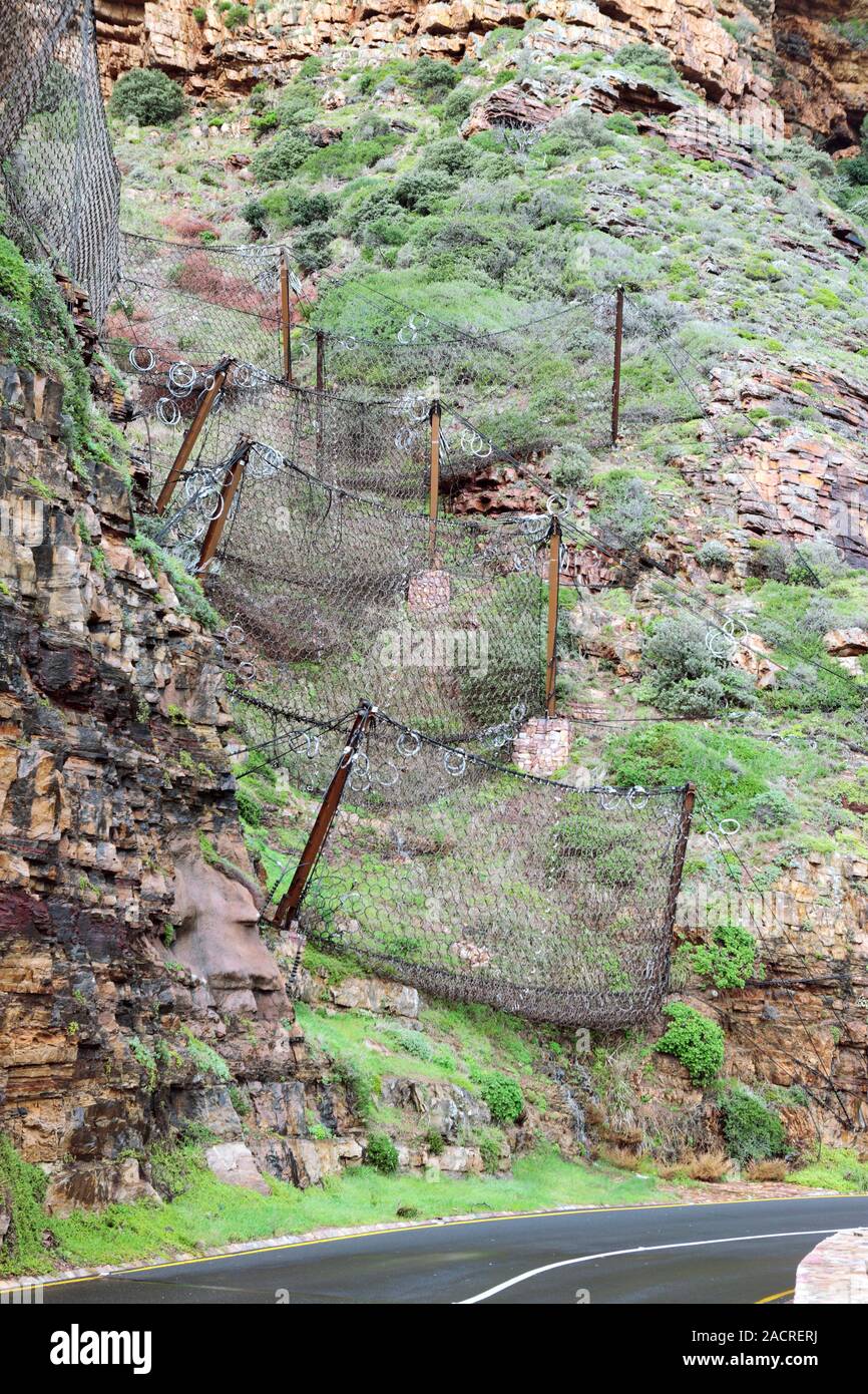 Rockfall nets on a cliff. These nets are used to stop rocks that fall ...