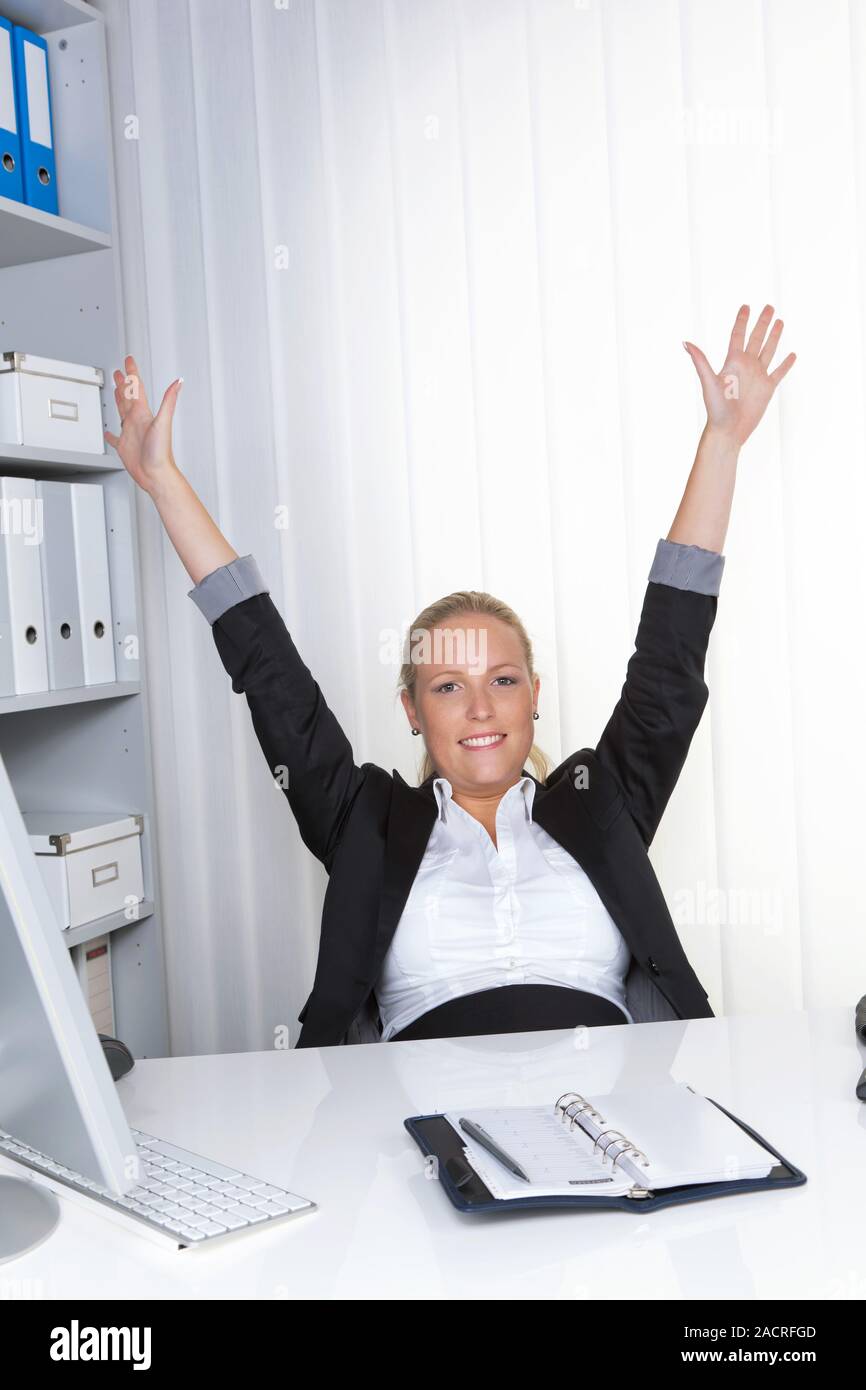 Business woman cheers at work Stock Photo - Alamy