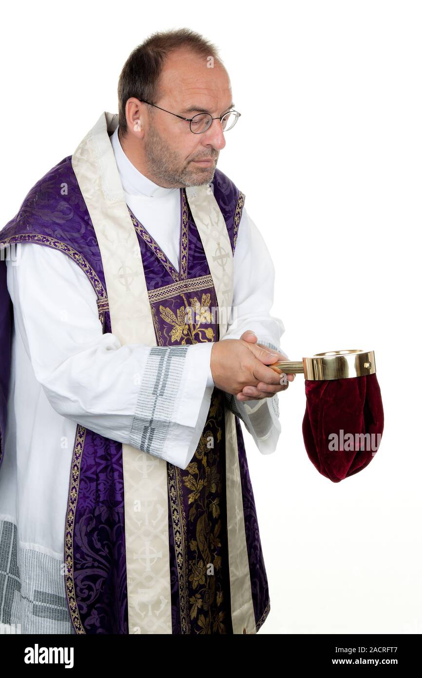 Catholic priest collects money for the church Stock Photo - Alamy
