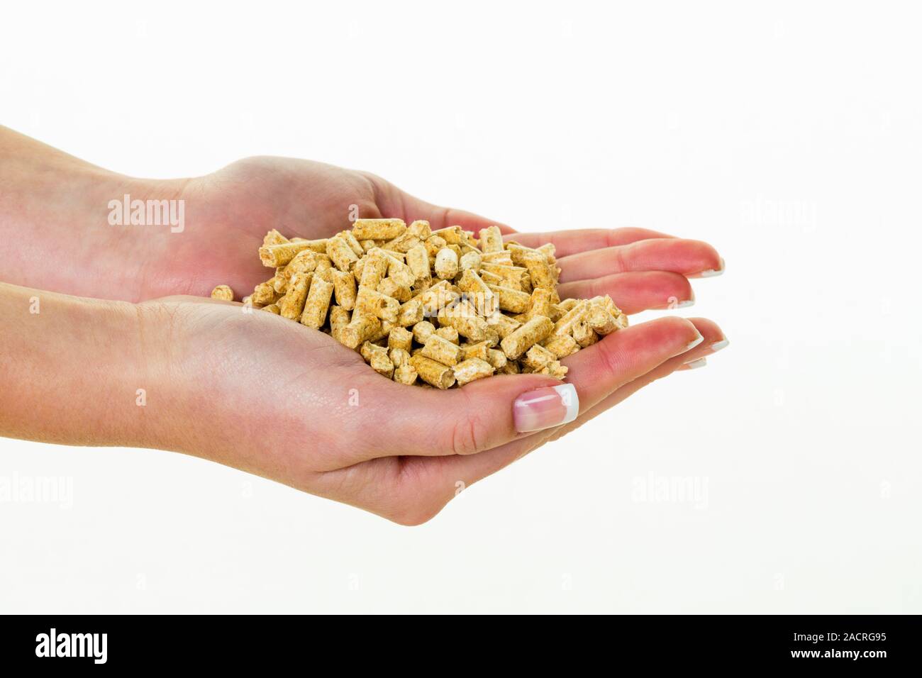 Hand with pellets as an alternative energy source Stock Photo - Alamy