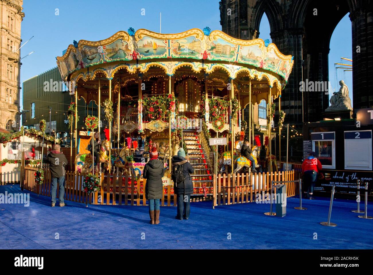 Double Carousel fairground ride and Sir Walter Scott Monument ...