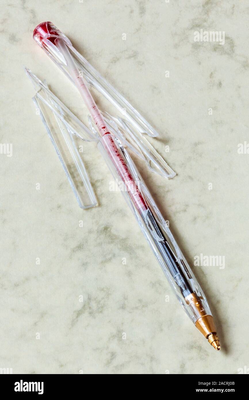 Broken ballpoint pen. The plastic casing of the ballpoint pen is made ...