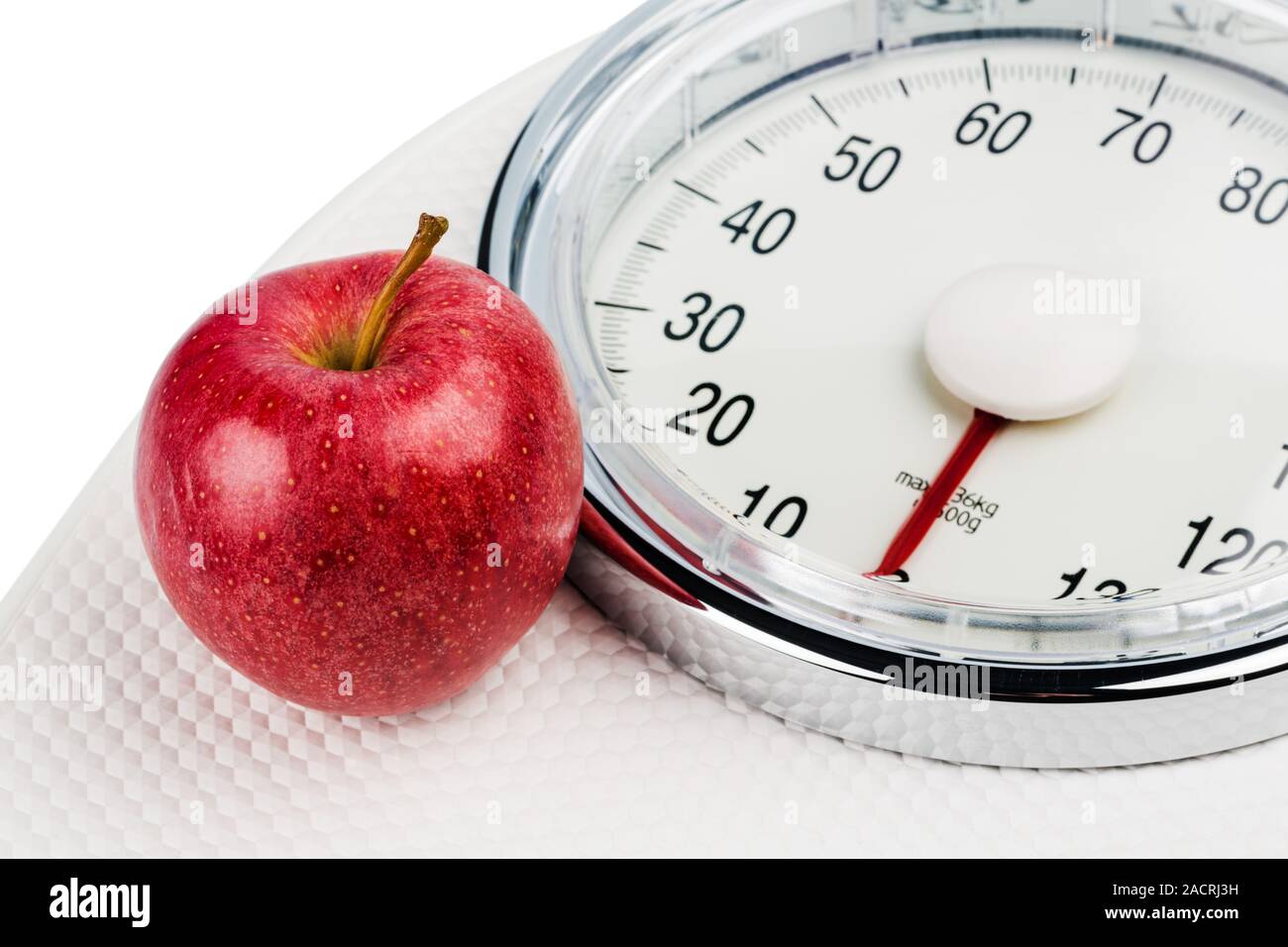 Apple lies on a scale Stock Photo - Alamy