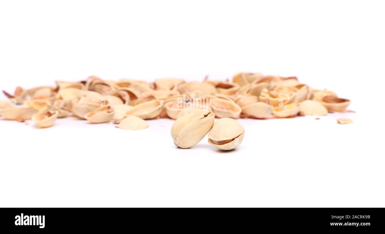 Two pistachios and peel Stock Photo - Alamy