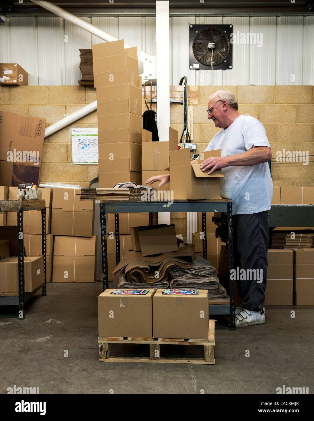 Printing company packing area. Printed materials being packed at a ...