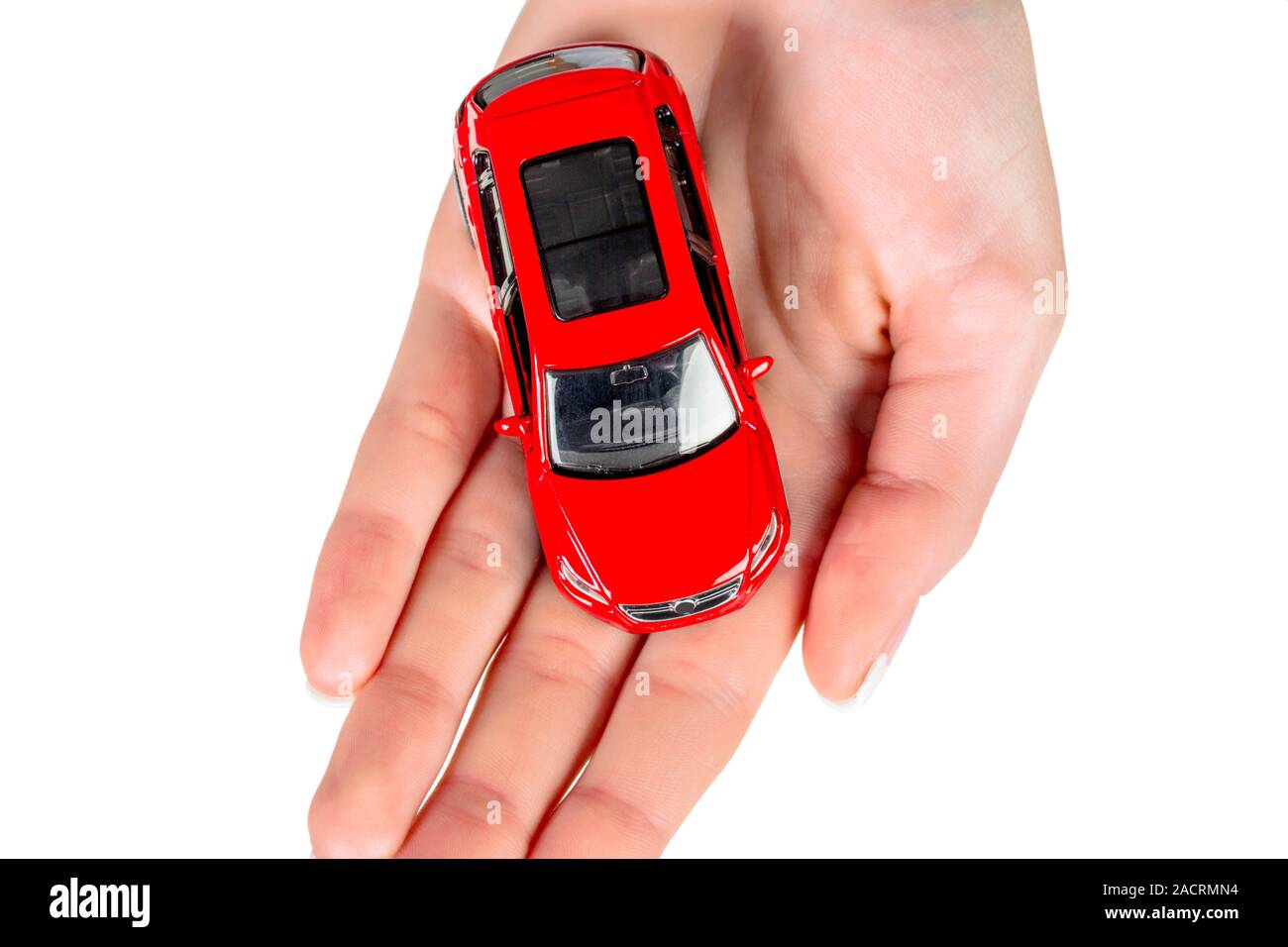 Hand holds model of a car Stock Photo - Alamy