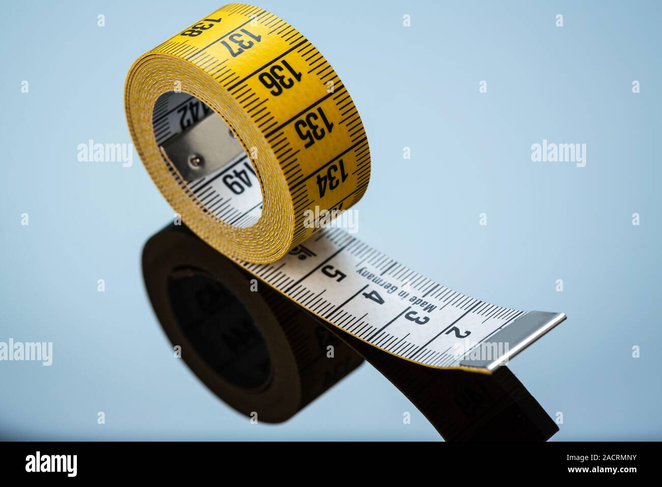 Yellow tape measure Stock Photo - Alamy
