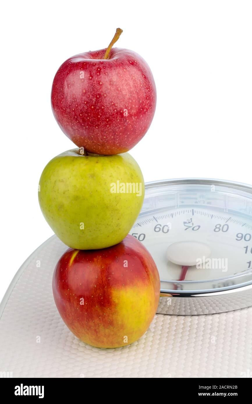 Apples on a scale Stock Photo - Alamy