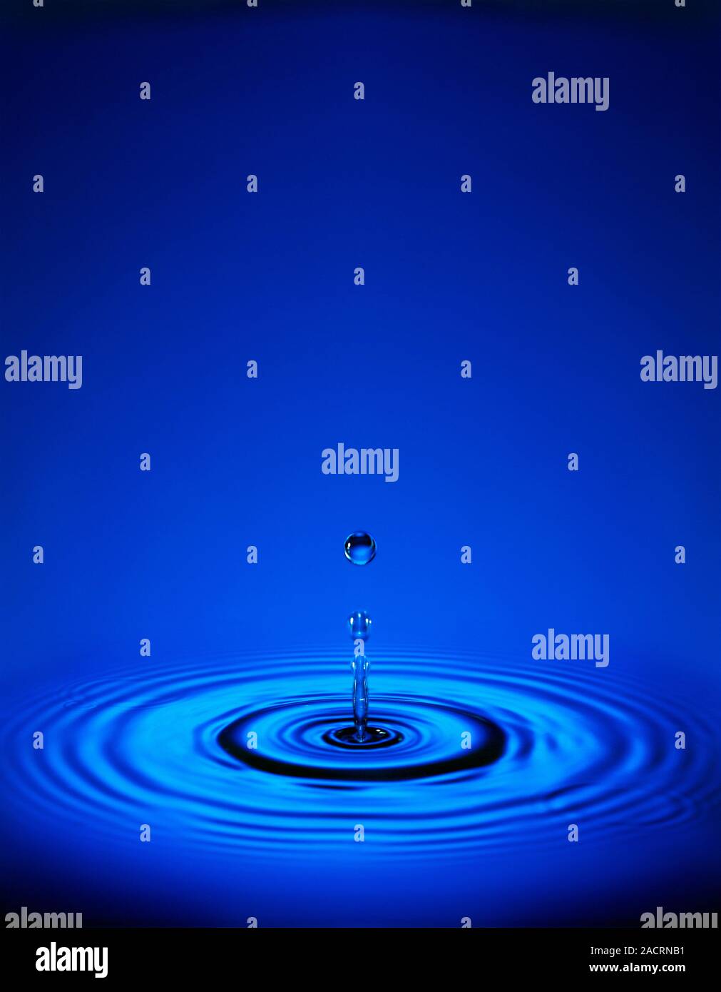 Water drop impact. The impact forms a crater and the surface of the ...