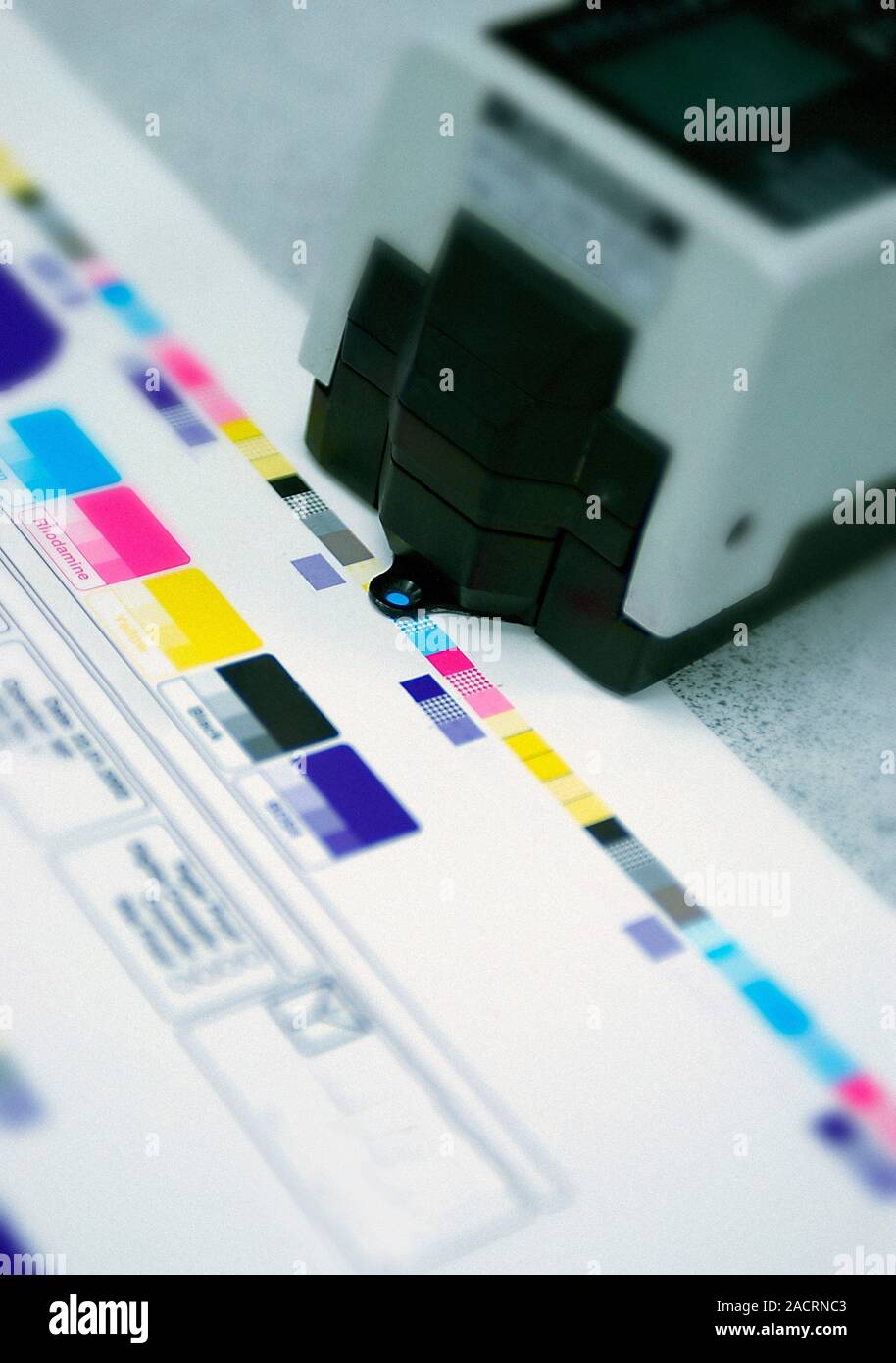 Densitometer checking printed colours. This machine checks the colour ...