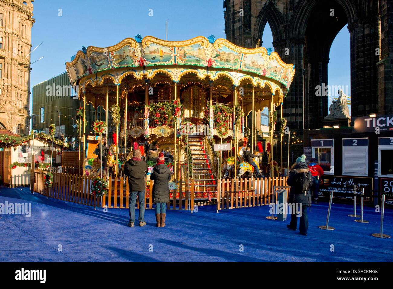 Double Carousel fairground ride and Sir Walter Scott Monument ...